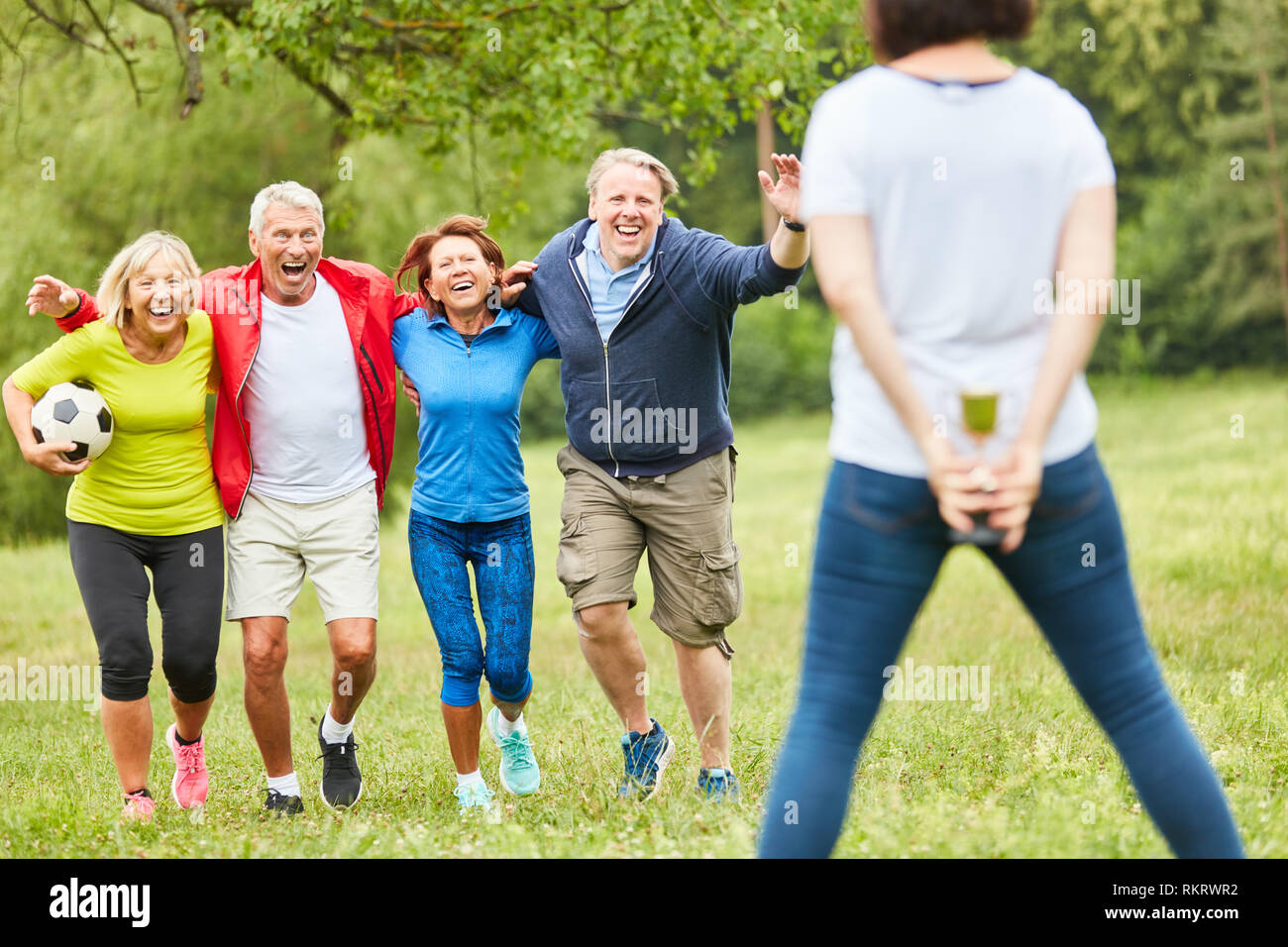 Group seniors as friends and successful winning team in football Stock ...
