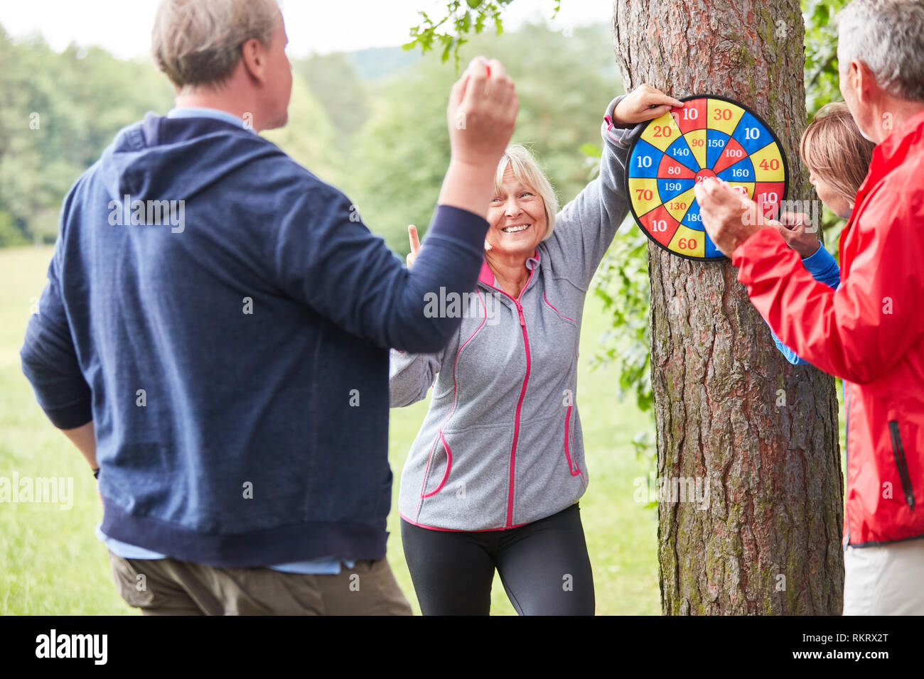 Group of seniors playing darts as a hobby or at a competition Stock ...