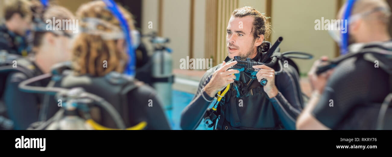 Diving instructor and students. Instructor teaches students to dive ...