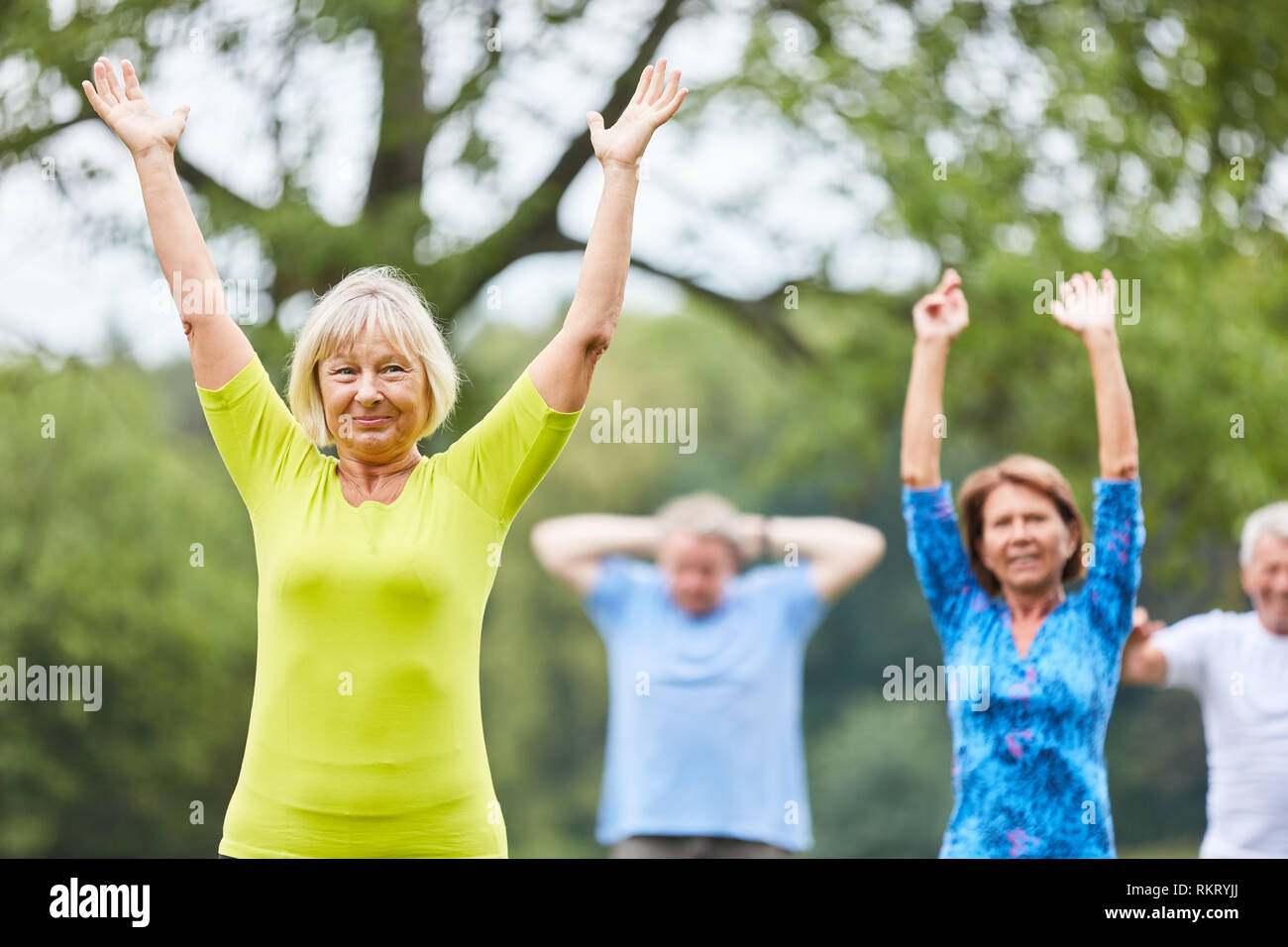 Group of seniors in a gym class during back training in rehab Stock ...