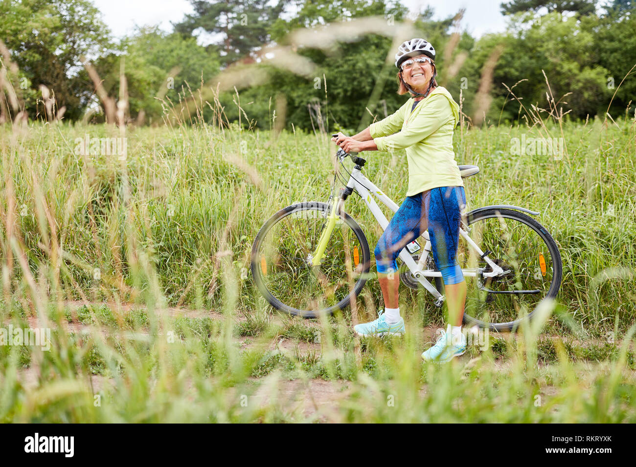 Senior citizens riding bike hi-res stock photography and images - Alamy