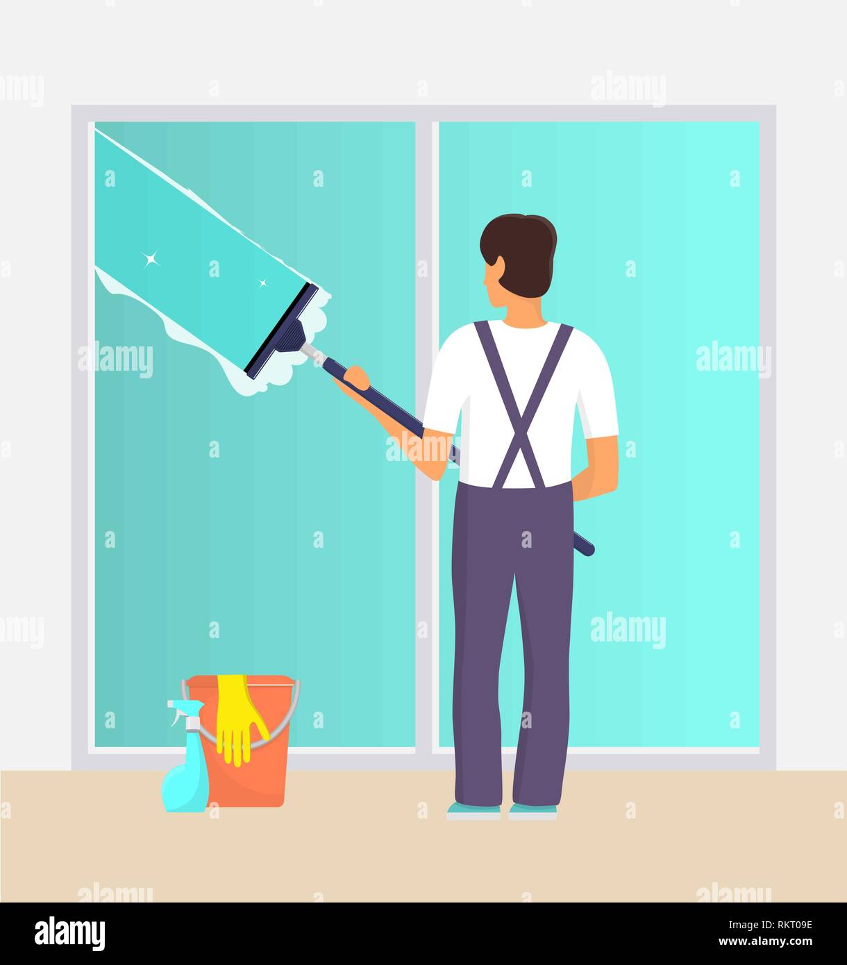 Man in uniform cleaning window with glass scraper and washing spray ...