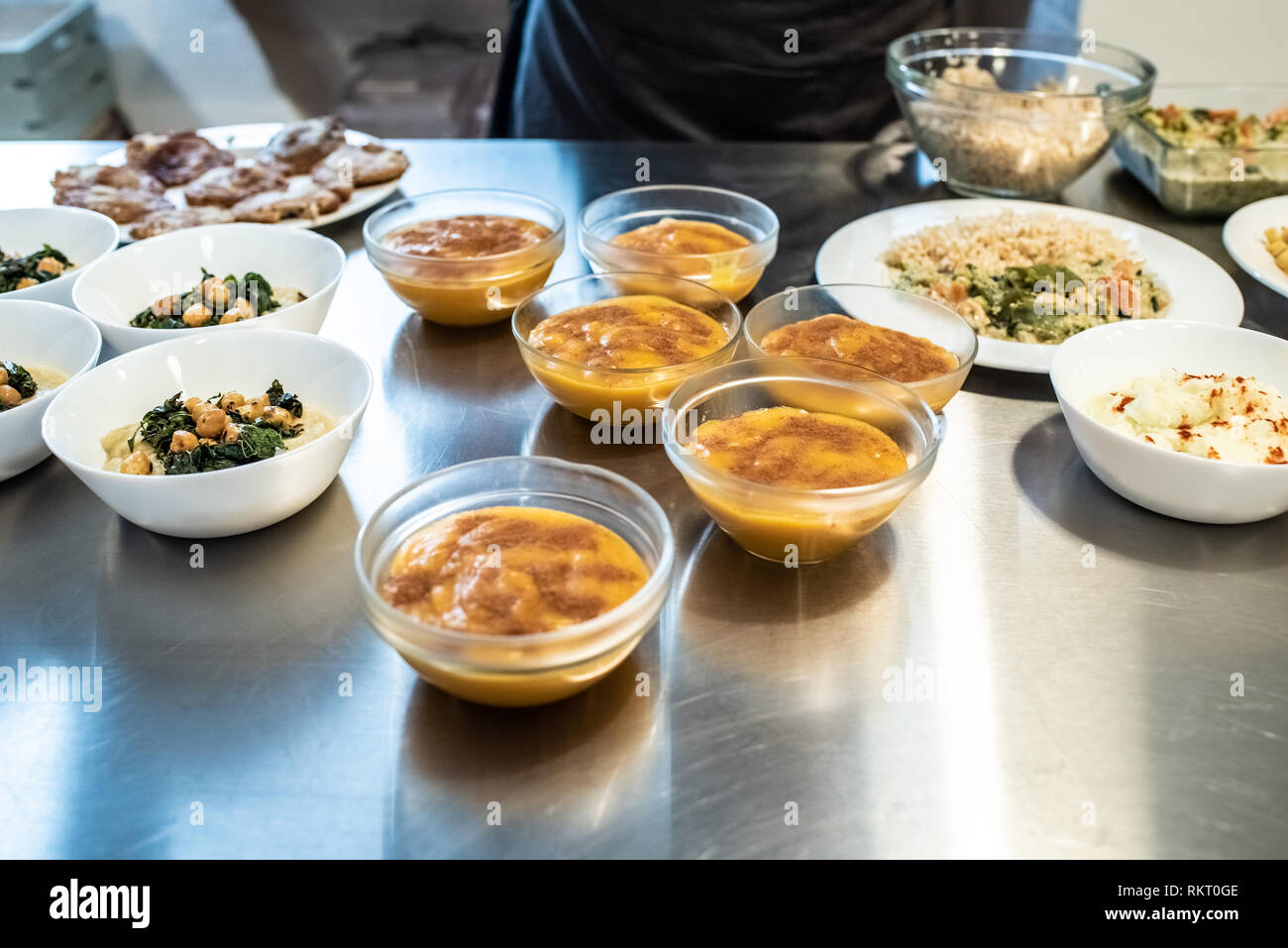 Cook plating their dishes and serving them hot and tasty Stock Photo ...