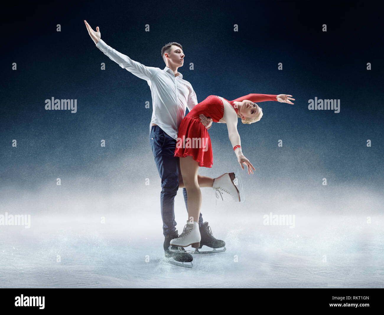 Professional man and woman figure skaters performing show or ...