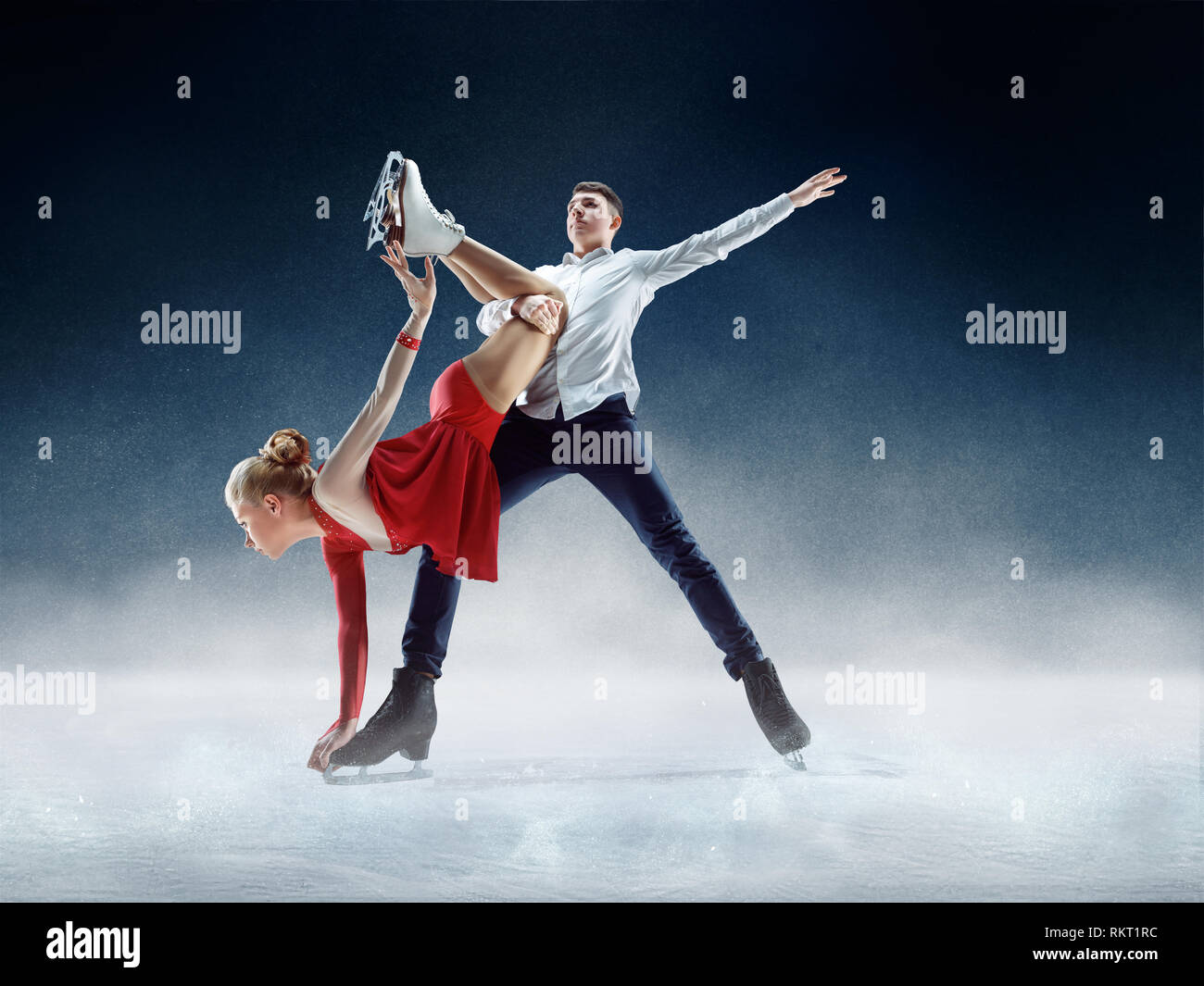 Professional man and woman figure skaters performing show or ...
