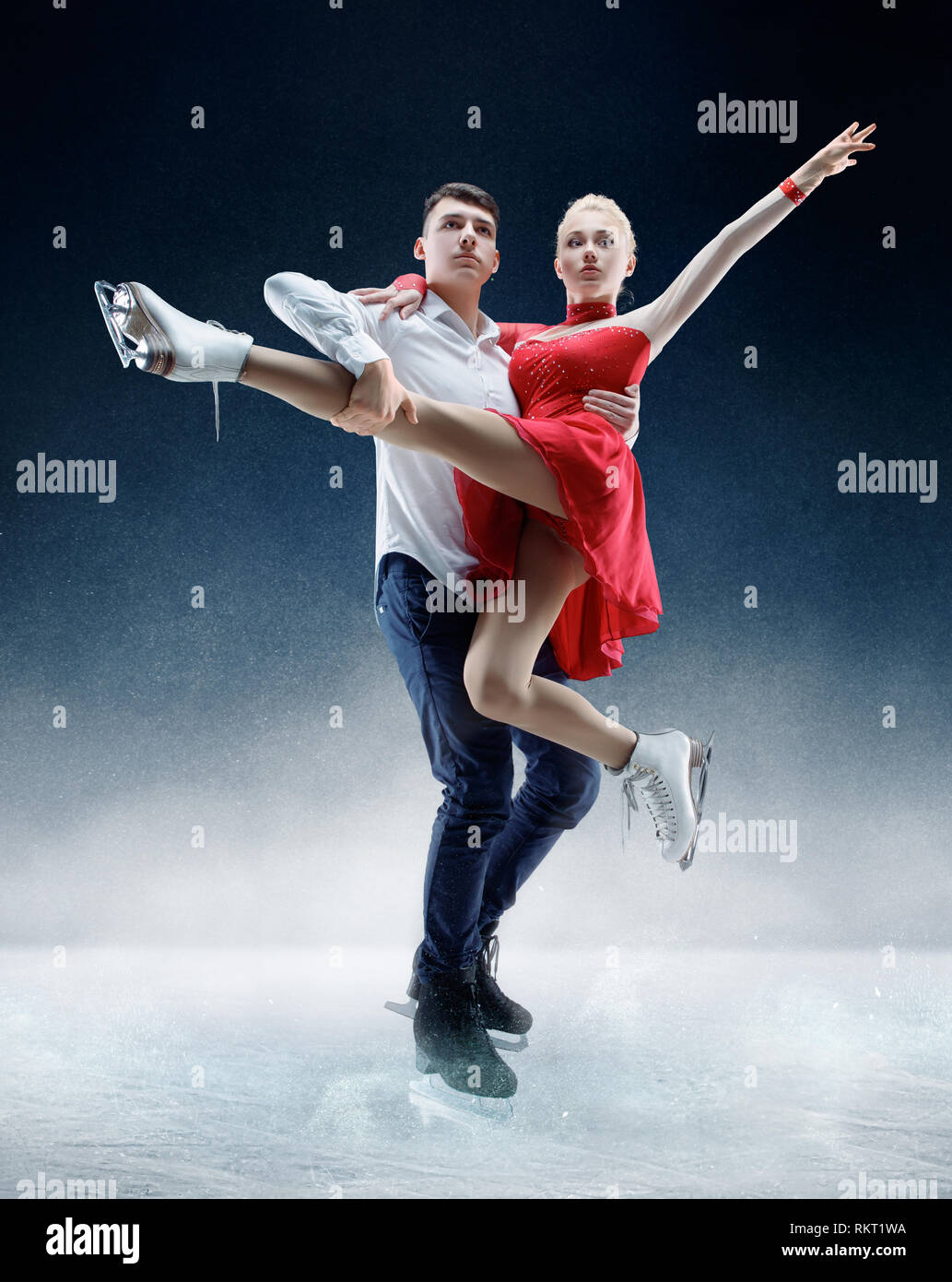Professional man and woman figure skaters performing show or ...