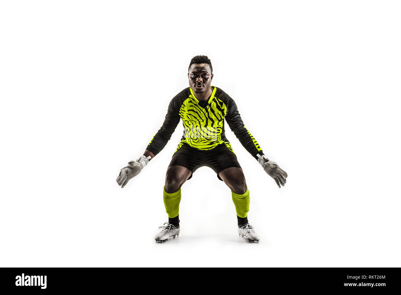 Goalkeeper ready to save on white studio background. Soccer football ...