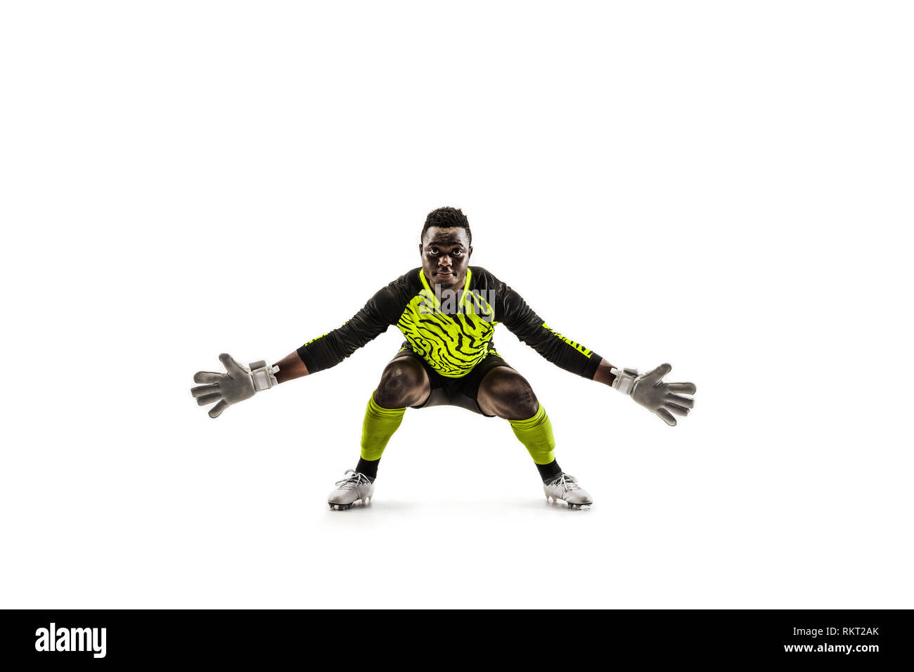 Goalkeeper ready to save on white studio background. Soccer football ...