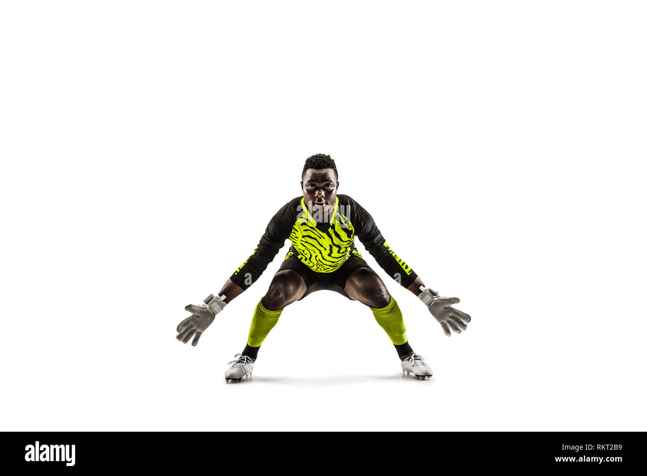 Goalkeeper ready to save on white studio background. Soccer football ...