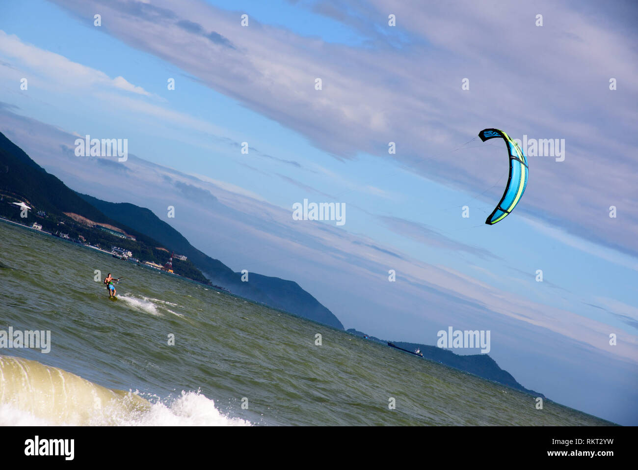 Kite surf rider on a sea waves in summer day. Perfect wind and weather ...
