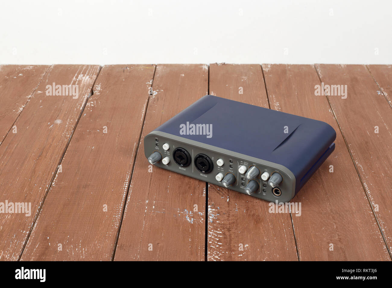 Music and sound - front view interface sound card on a white and wooden ...