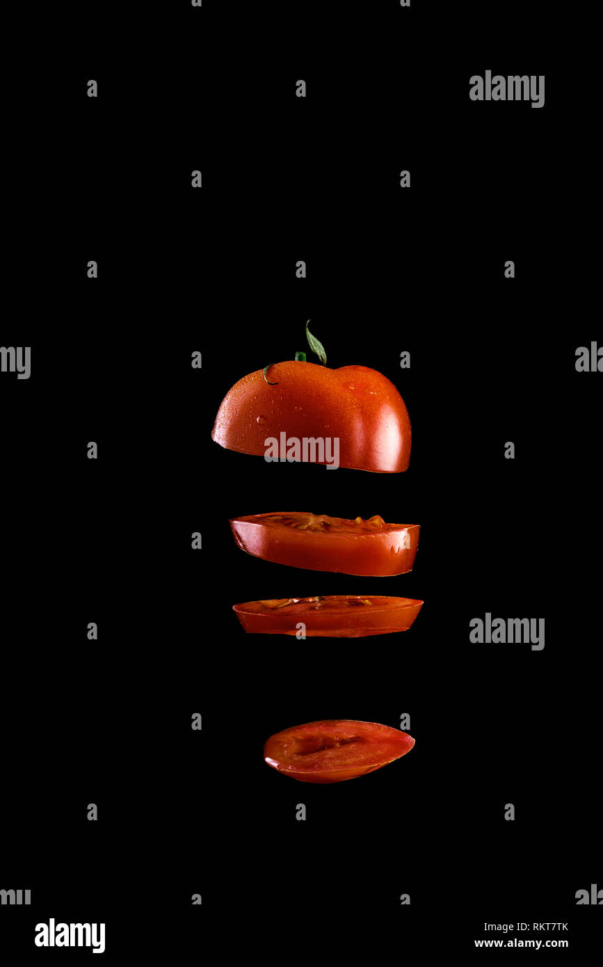 Creative concept with flying vegetables on an black background. Levity ...