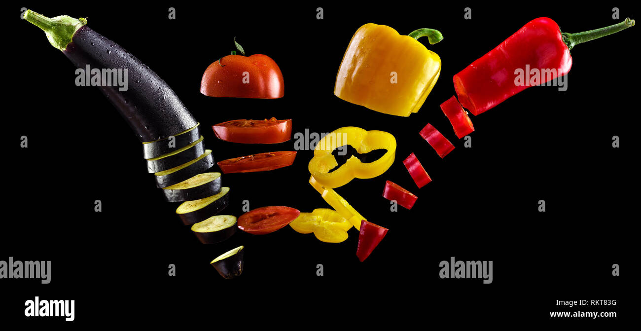 Creative concept with flying vegetables on an black background. Levity ...