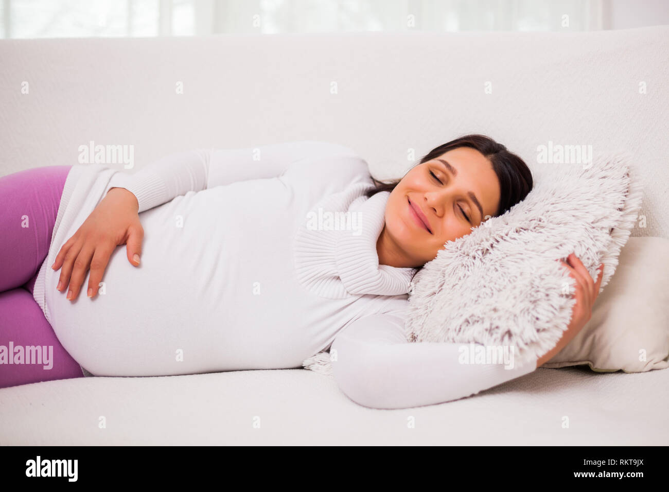 Happy pregnant woman relaxing at home Stock Photo - Alamy