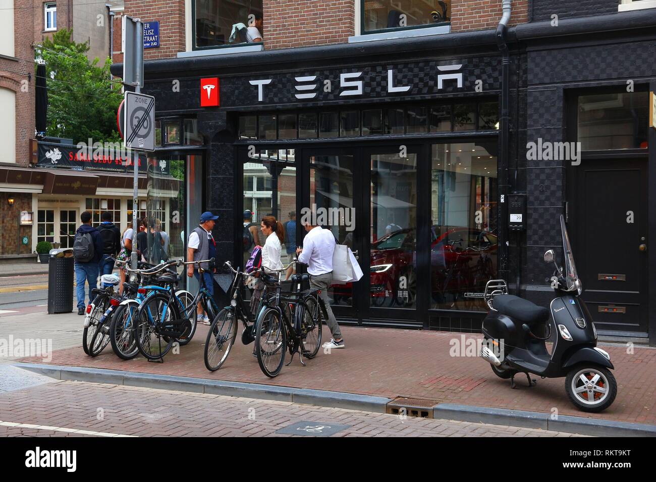 AMSTERDAM, NETHERLANDS - JULY 10, 2017: People visit Tesla car ...