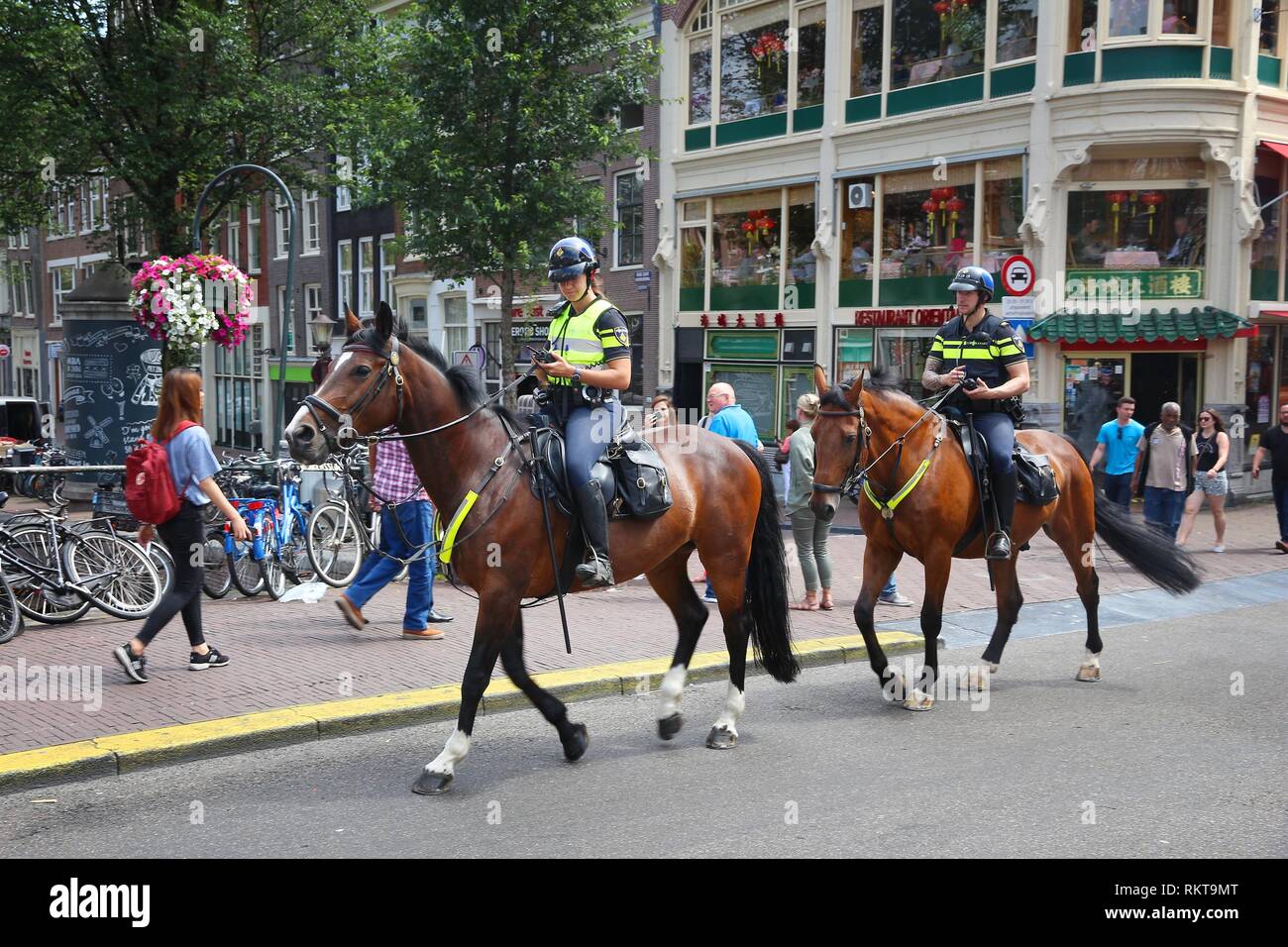 AMSTERDAM, NETHERLANDS - JULY 10, 2017: Equestrian police officers ...