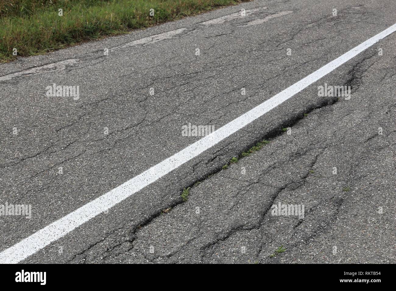 Road surface damage - bad maintenance quality. Asphalt cracks in Italy ...