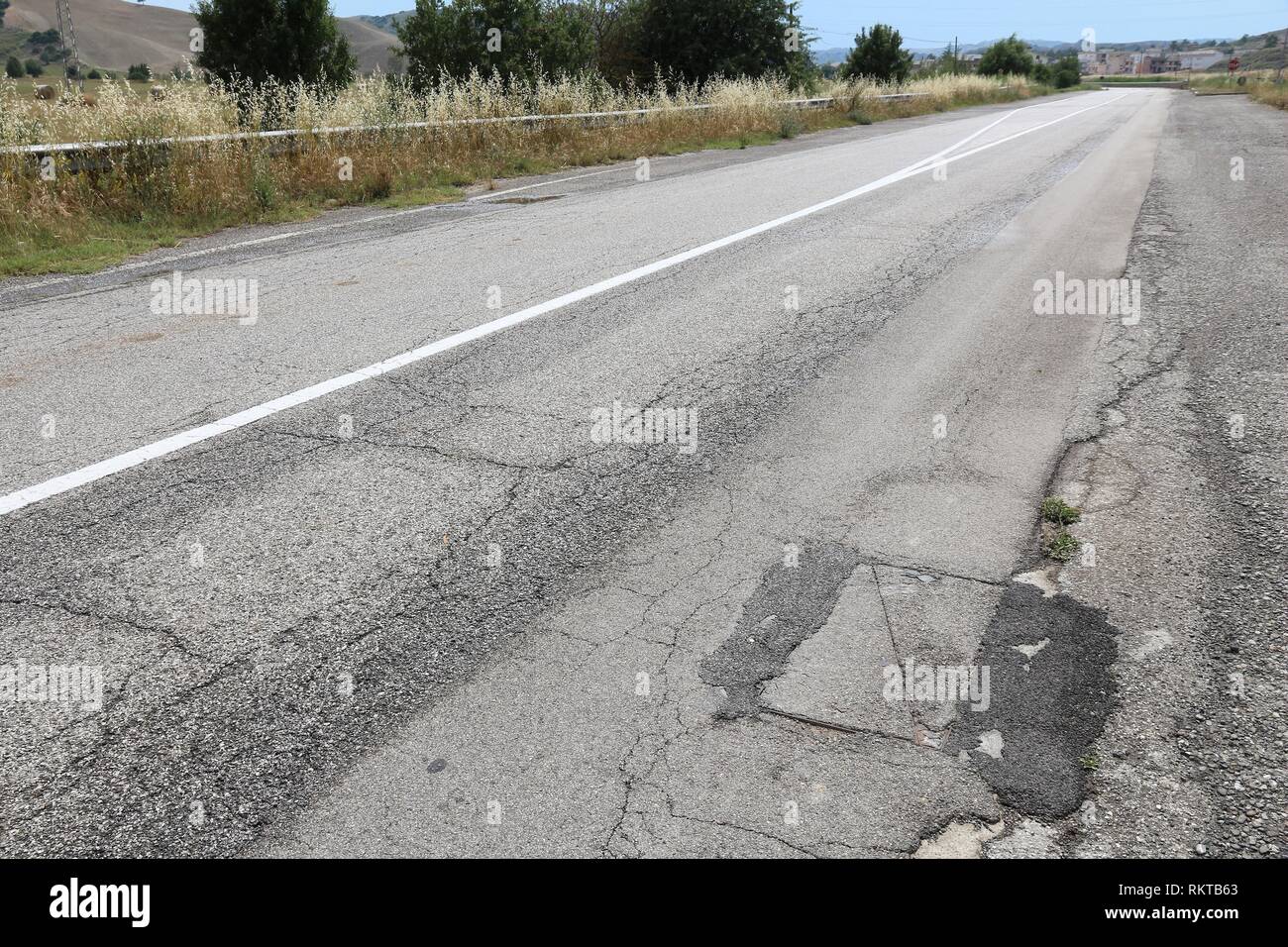 Road surface damage - bad maintenance quality. Asphalt cracks in Italy ...