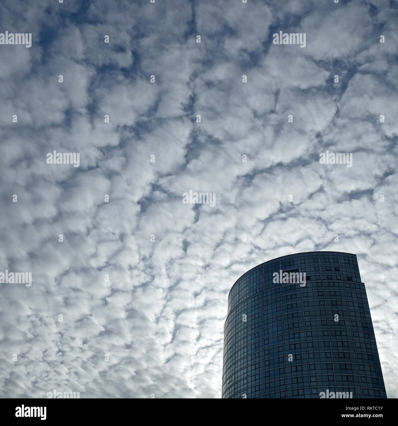 Mackerel sky, (alto cumulus) above Obel Tower, Laganside, Belfast Stock ...