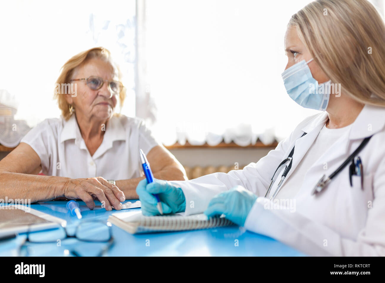 Senior woman during a medical exam with her practitioner Stock Photo ...
