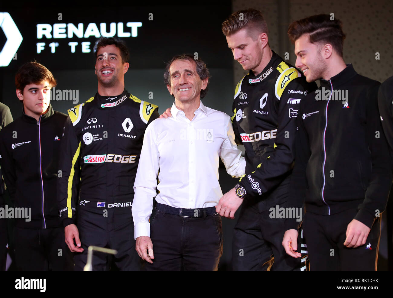 Drivers Nico Hulkenberg (right) and Daniel Ricciardo pose with retired ...
