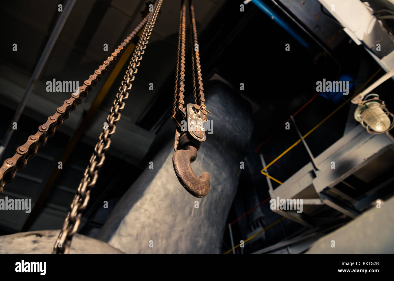 big iron hook with chains at factory placement background Stock Photo ...