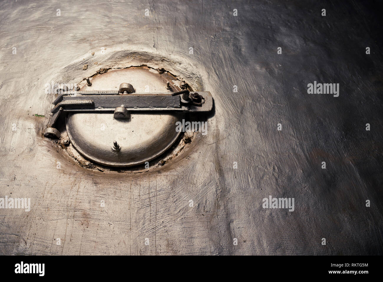 closed circle manhole inside wall cover with silver paint Stock Photo ...