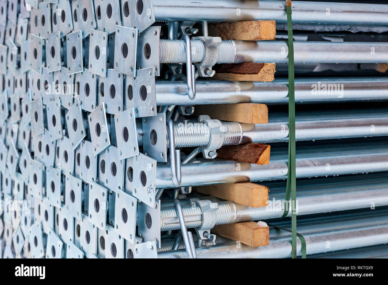 metal structures in a warehouse in stacks. metal supports for ...