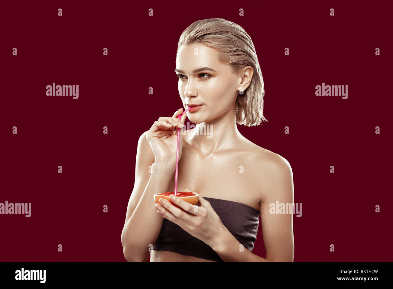 Slim young model wearing short open shoulder top Stock Photo - Alamy
