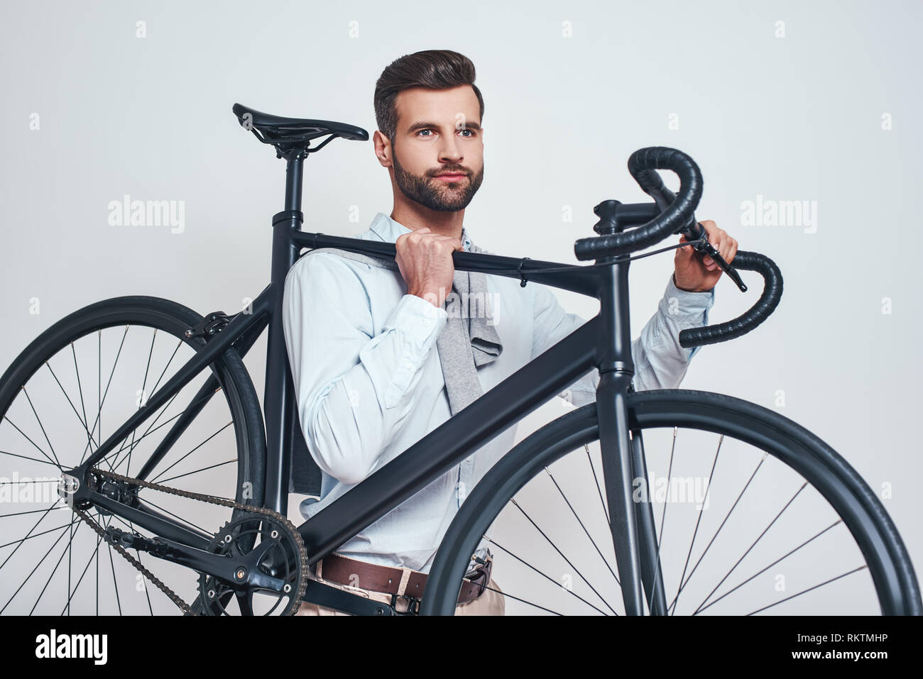 Best transport. Close up photo of good looking man in casual clothes ...