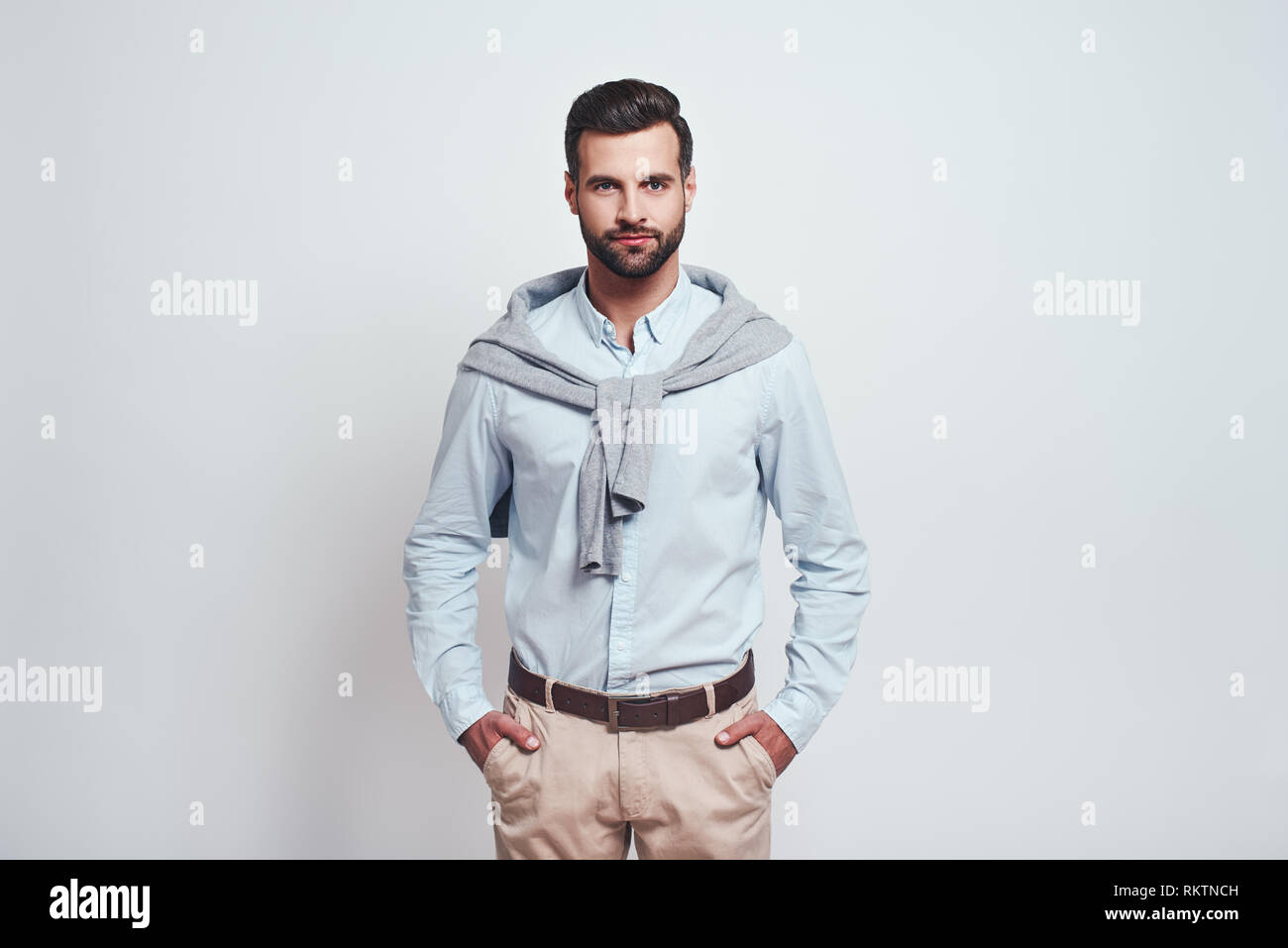 Guy putting hands in pockets hi-res stock photography and images - Alamy