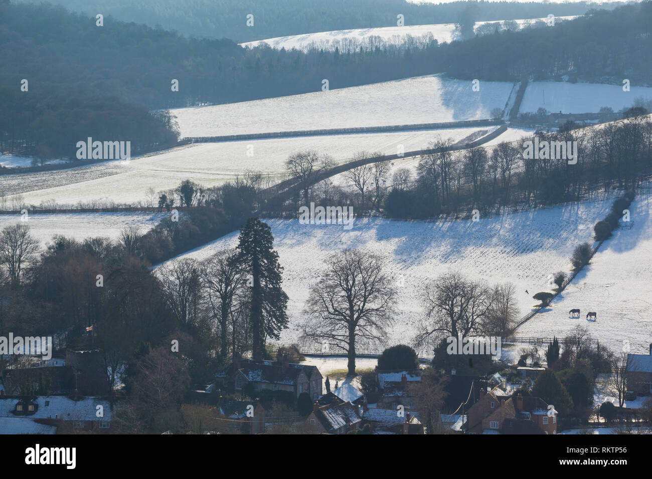 Winter view of the Chiltern village of Turville with snow on the ground ...