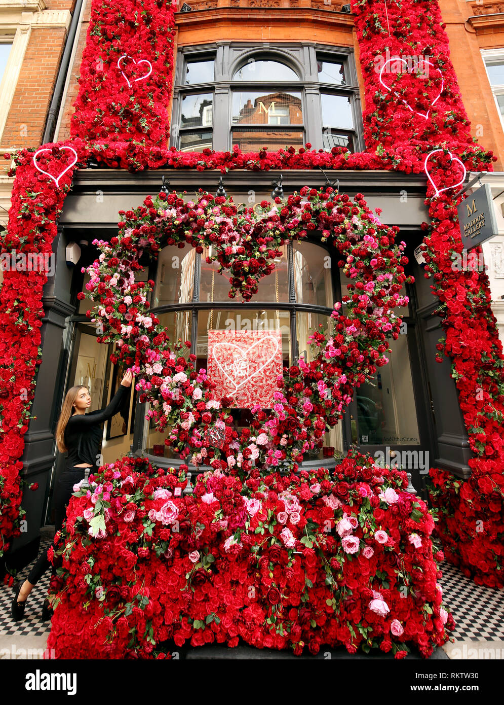 A gallery assistant tends to the augmented reality Valentine's Day ...