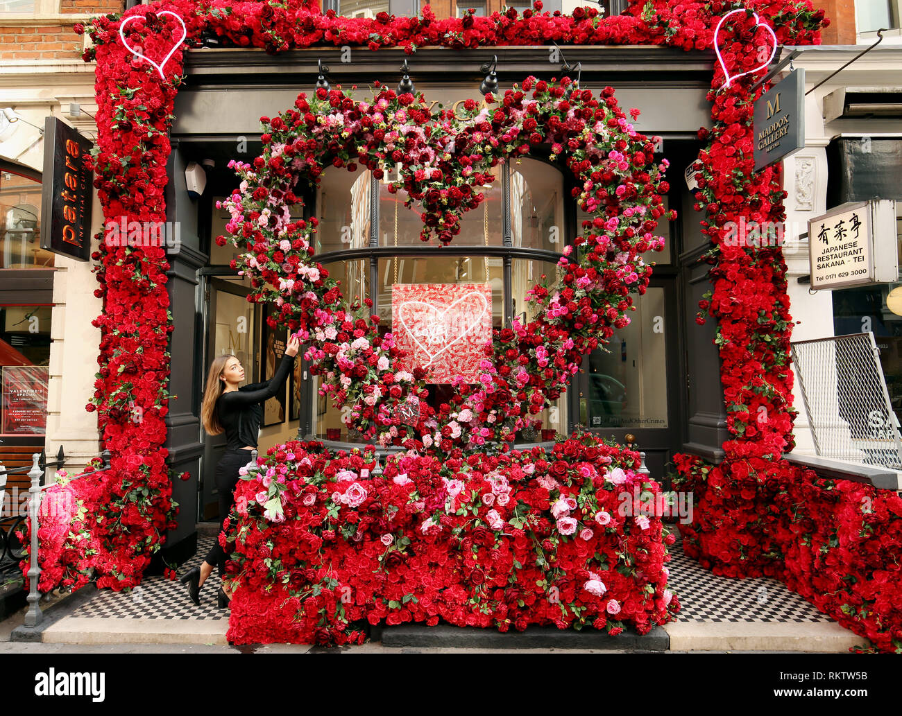 A gallery assistant tends to the augmented reality Valentine's Day ...