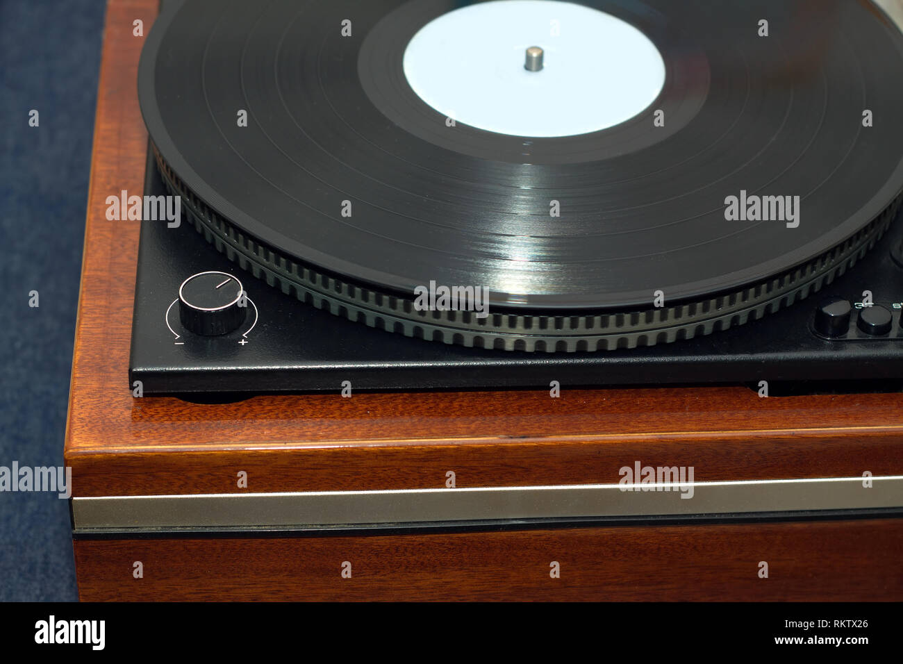 Part of vintage classic record player in wooden case with black LP ...