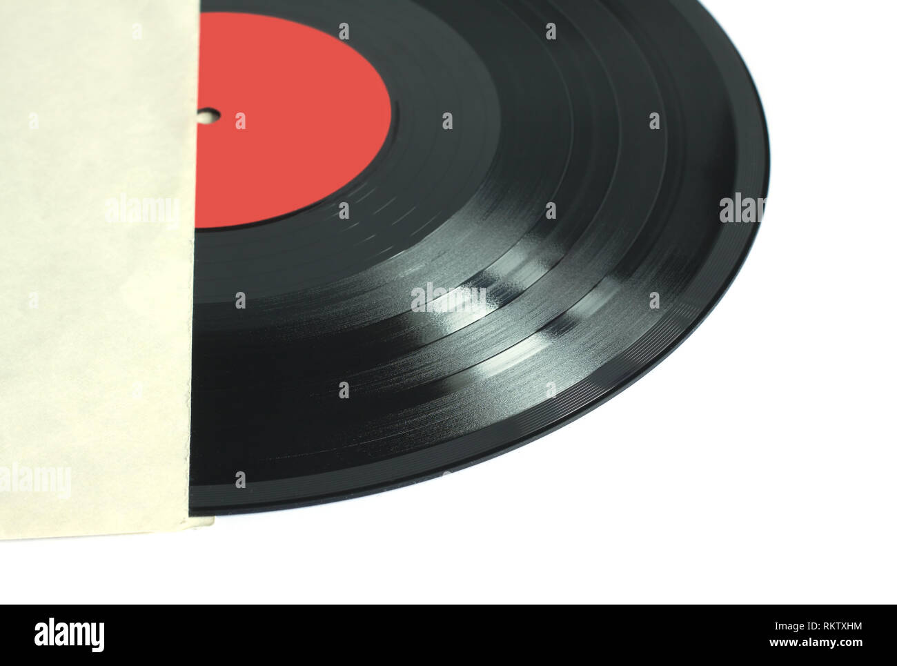 Part of black long-play vinyl record with red label isolated on white ...