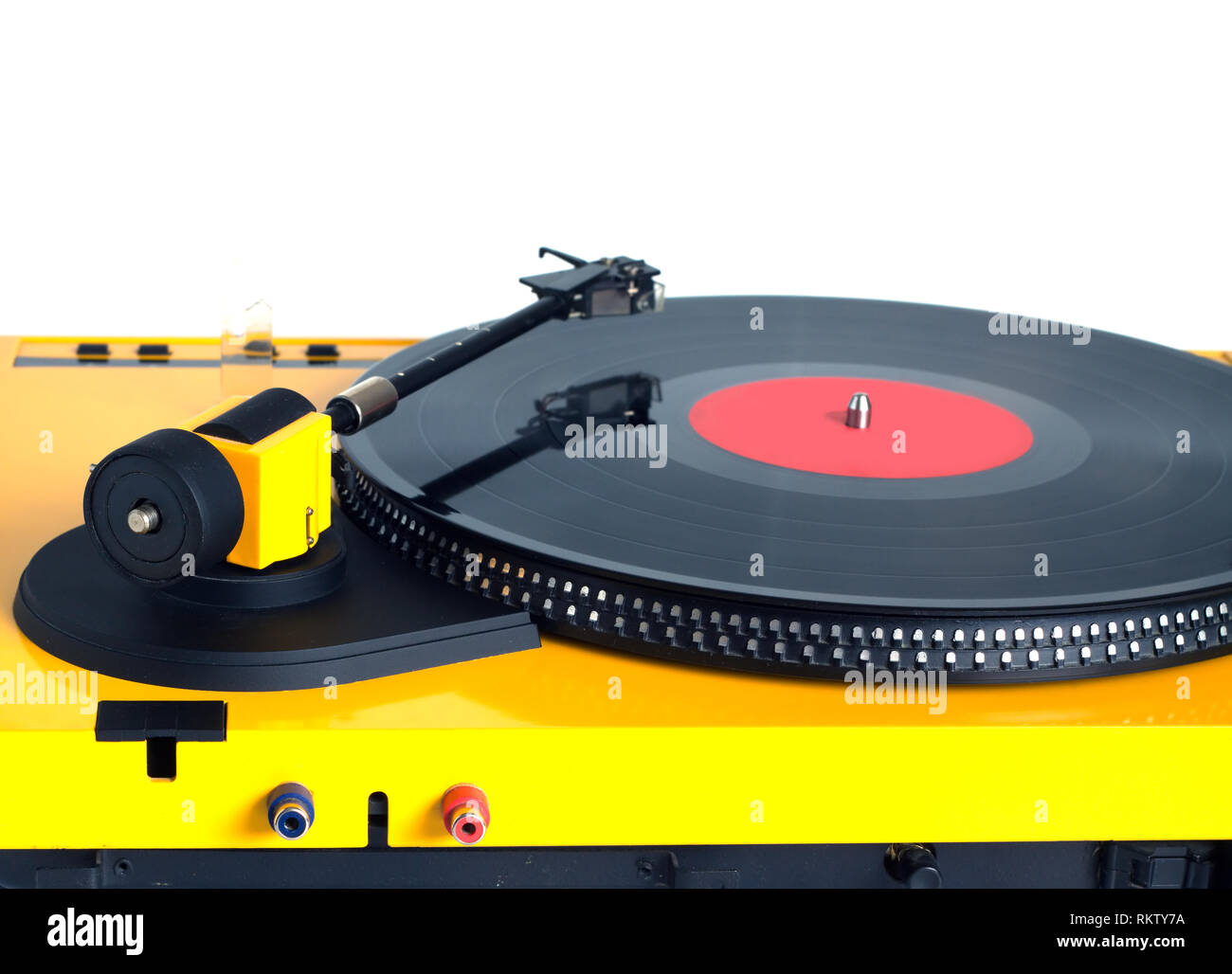 Turntable in yellow case with rotation vinyl record with red label ...