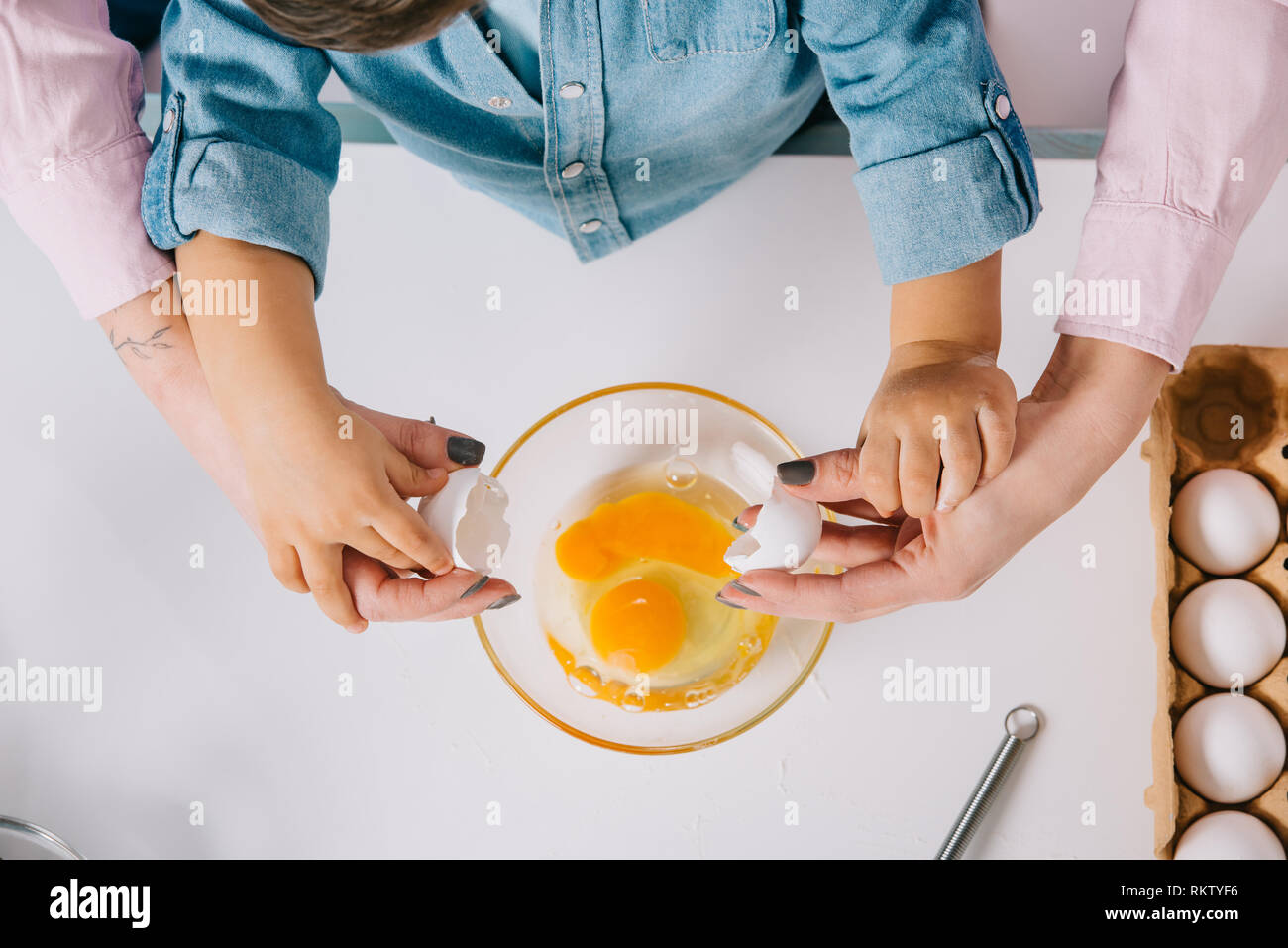Boy breaking an egg hi-res stock photography and images - Alamy