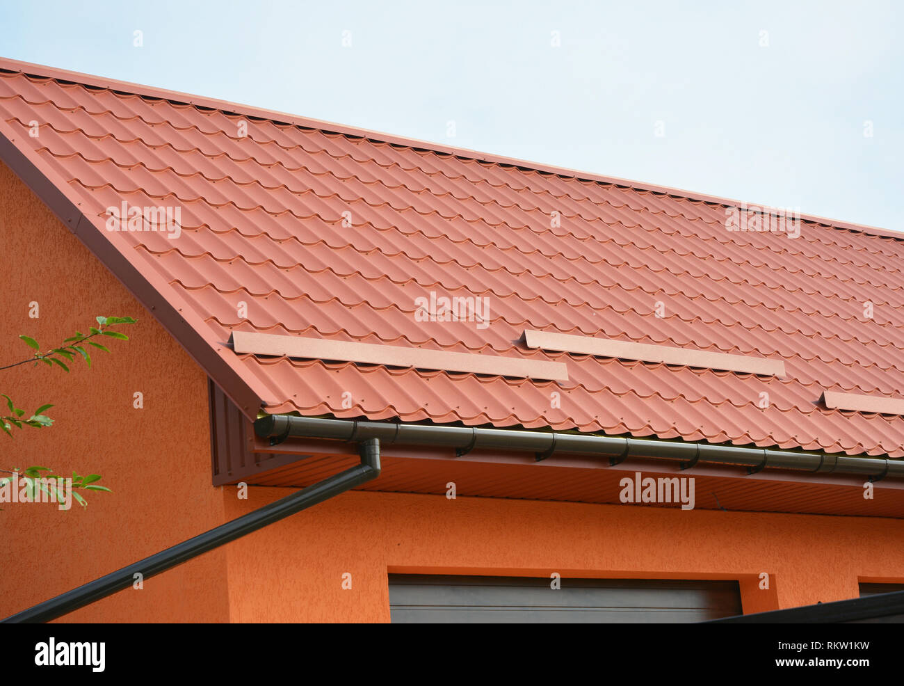 Building Modern House Construction with garage, metal roof, rain gutter ...