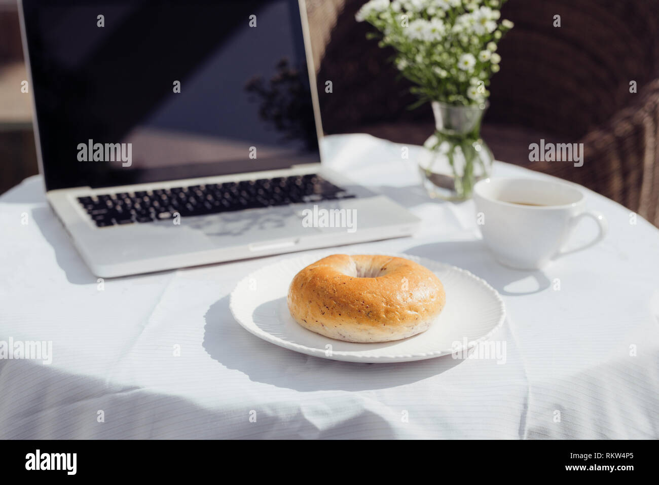 Laptop, bread and cafe in coffee shop Stock Photo - Alamy