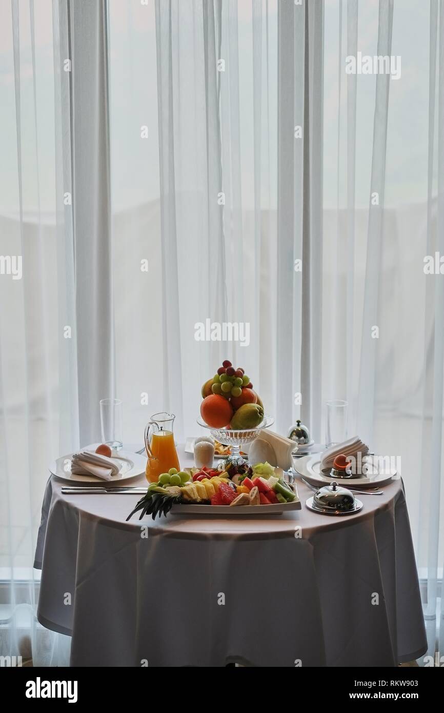 Delicious breakfast served for two at the hotel a white background ...