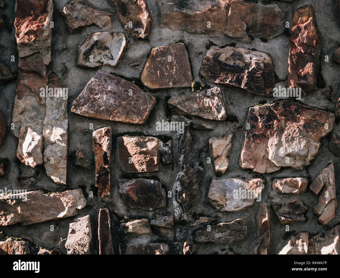 Rustic texture of raw rocks and cement Stock Photo - Alamy