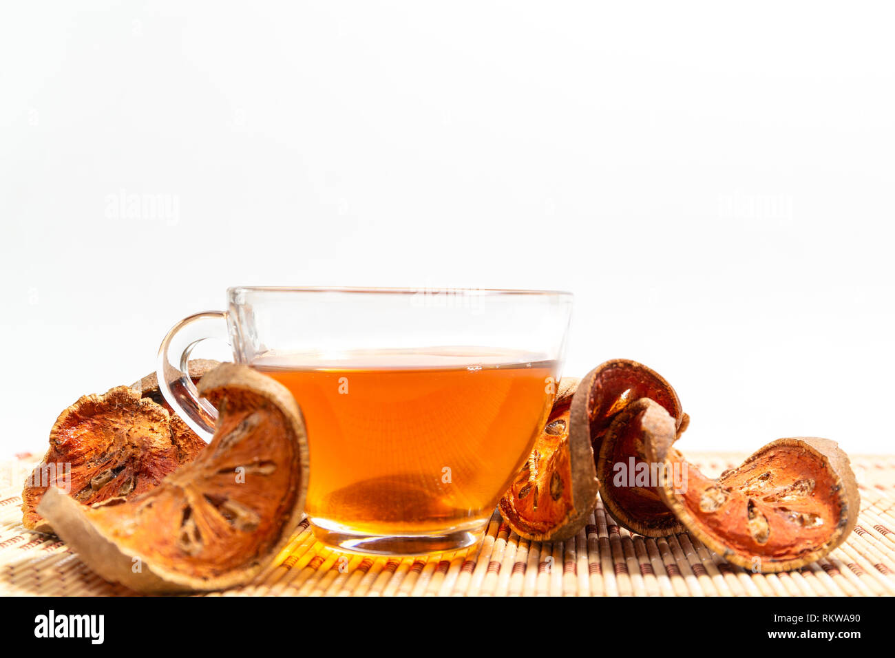Slices of dried bael fruit on white background Stock Photo - Alamy