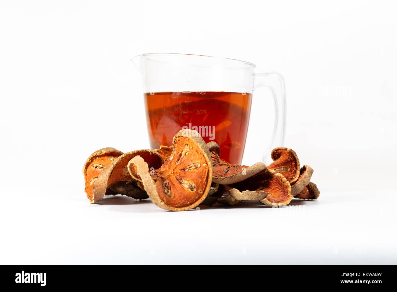 Slices of dried bael fruit on white background Stock Photo - Alamy