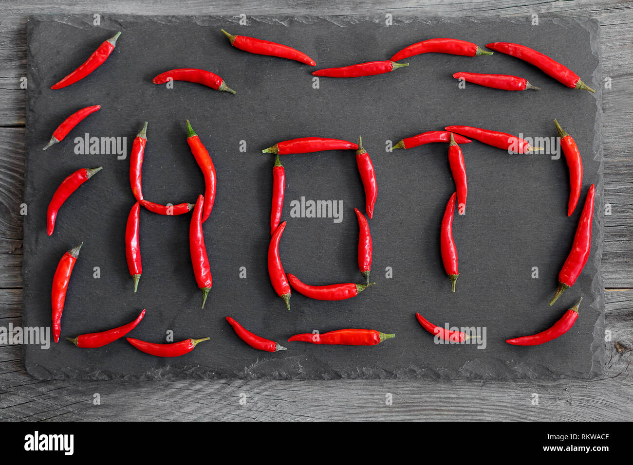 Red Hot Chili Peppers, Spelling the Word Hot on black background Stock ...