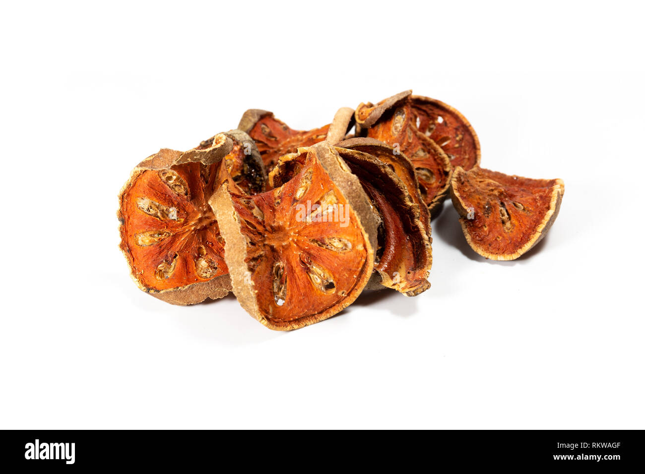 Slices of dried bael fruit on white background Stock Photo - Alamy