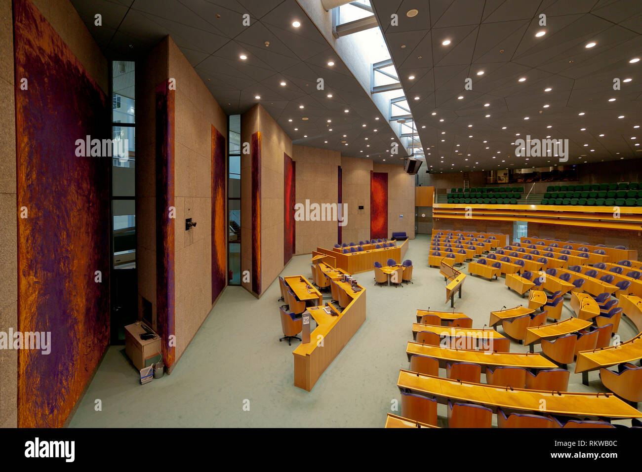 Wide view looking down on the interior of the empty plenary hall of the ...