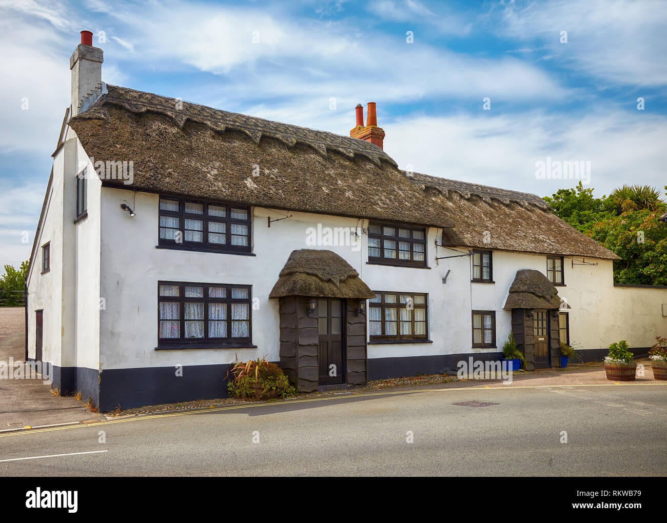 Beautiful thatched roof house in West Dorset. England Stock Photo - Alamy