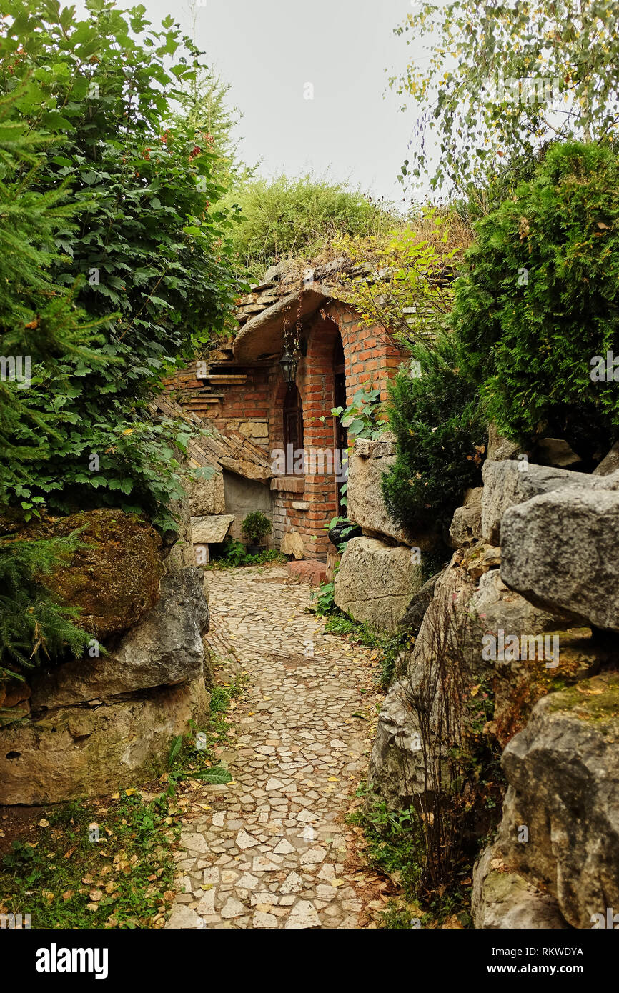 Footpath through a garden leading to the entrance of a Medieval English ...