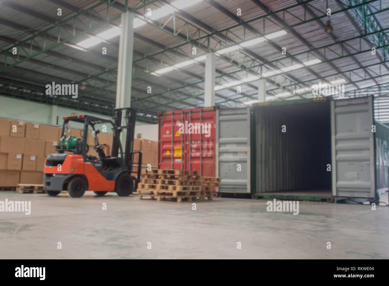 The forklift loading pallet with a forklift into a truck.(Blur picture ...
